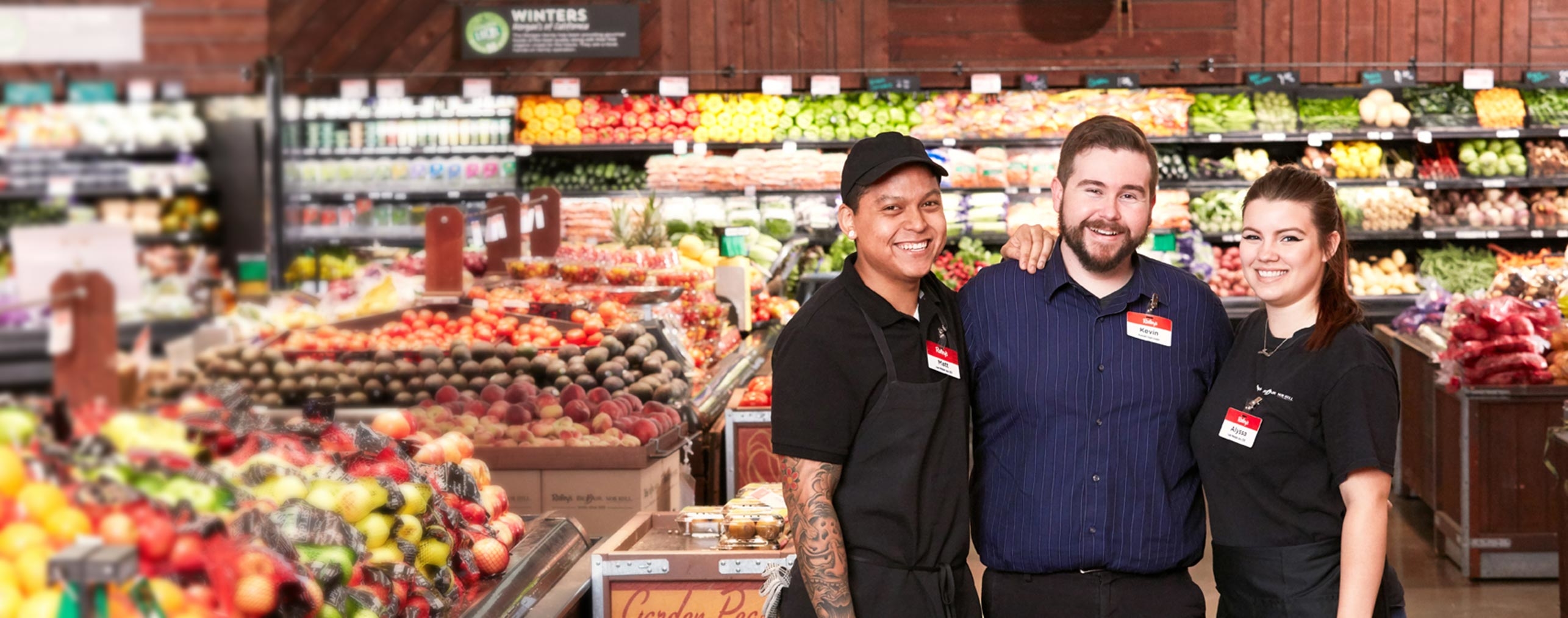 Image with a store team member standing inside a store