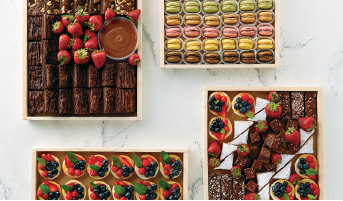 Image of a wooden party tray with brownies with nuts and chocolate ...